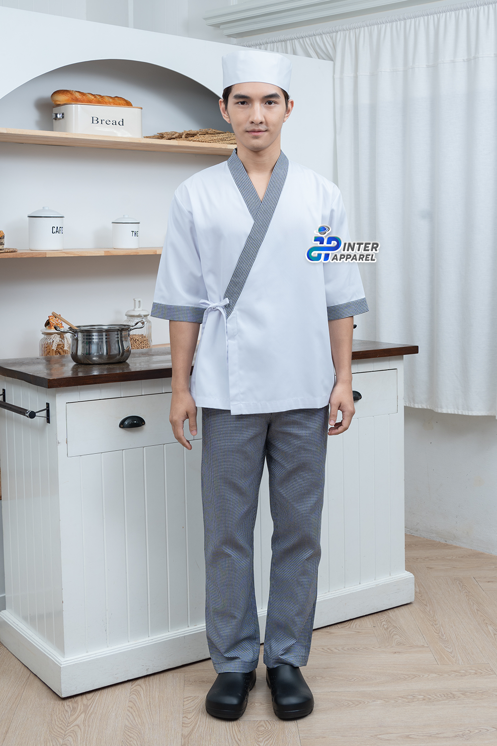 White Japanese chef coat with three-quarter sleeves and houndstooth piping.